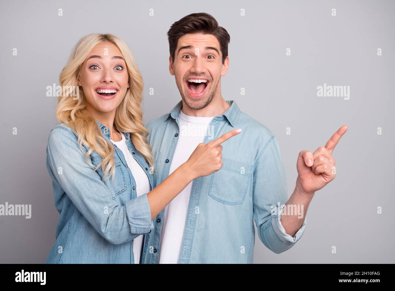 Portrait of beautiful handsome trendy friends friendship showing copy ...