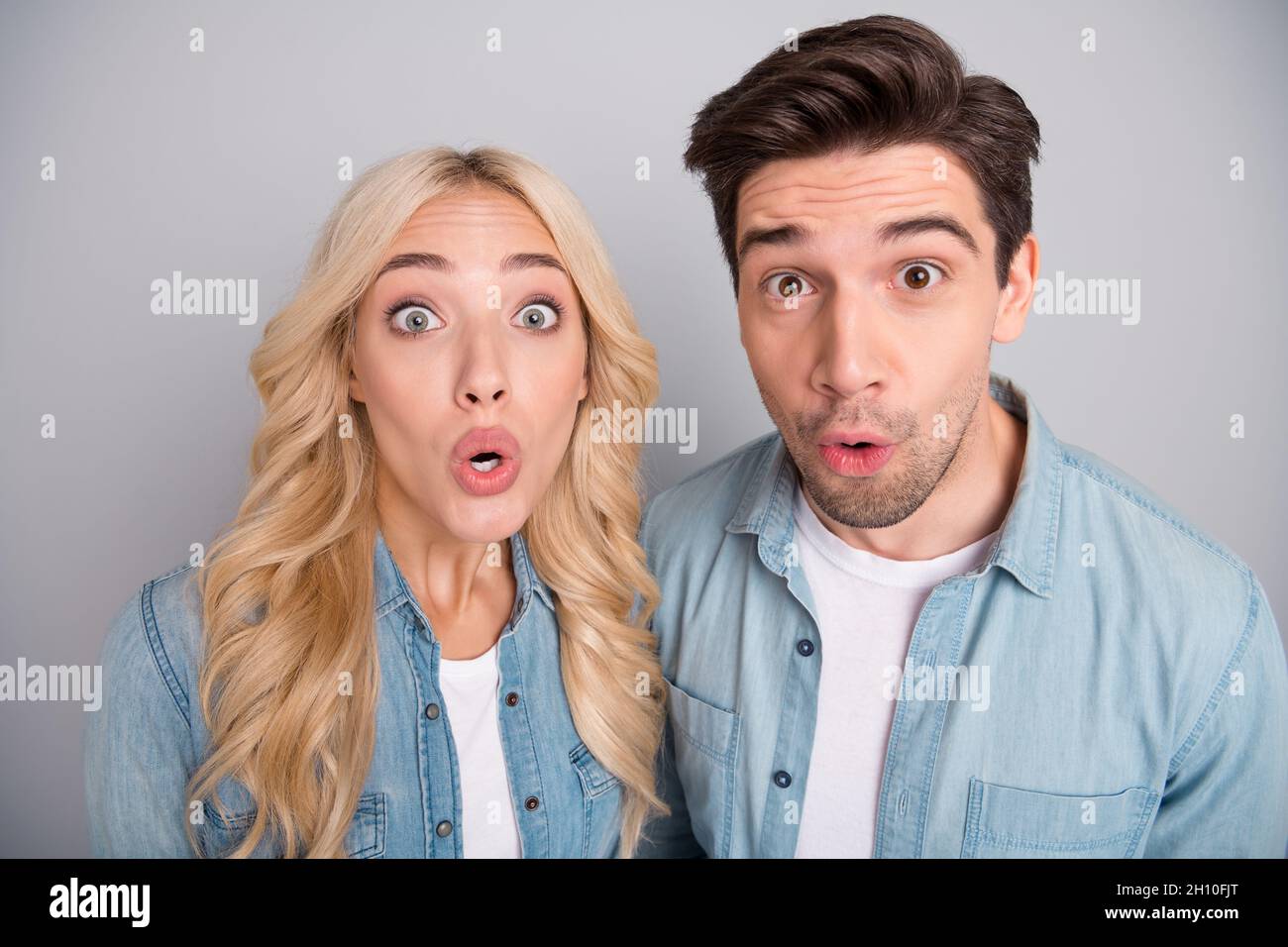 Photo of young couple look amazed shocked omg wow reaction information ...