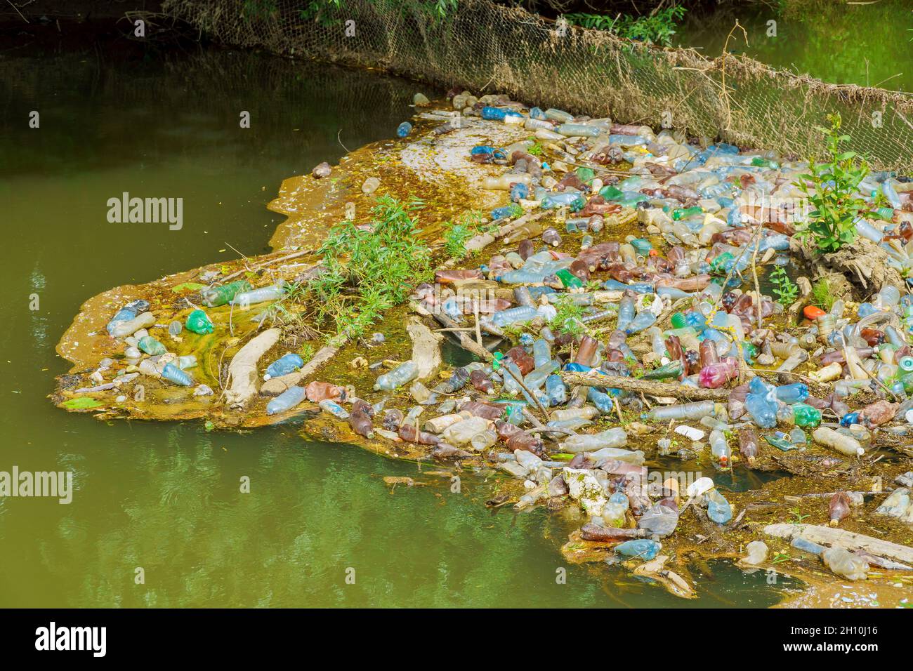 River pollution plastic bottles other trash on garbage on plastic at ...