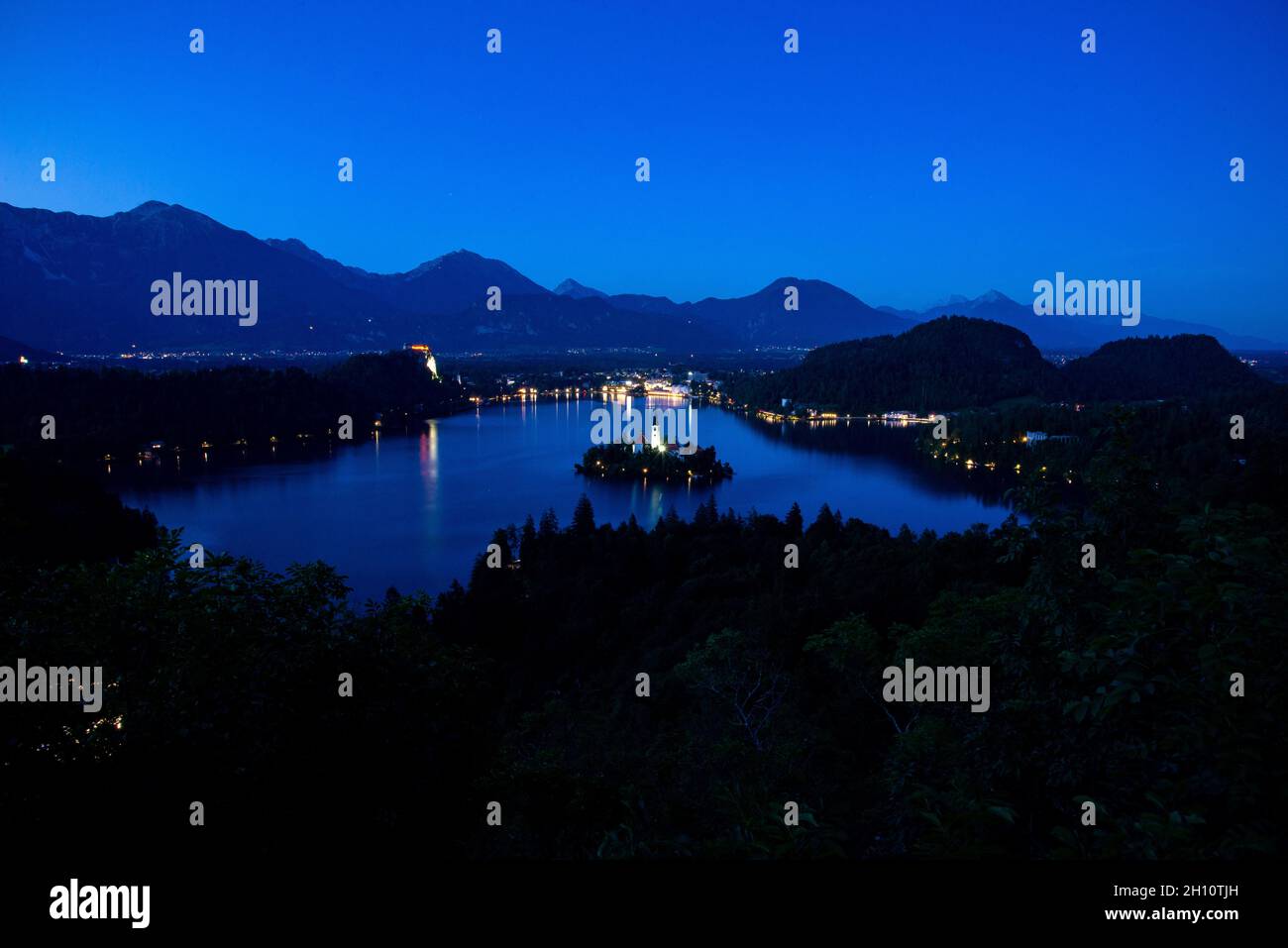Lake bled at blue hour with he the famous church on the island Stock ...