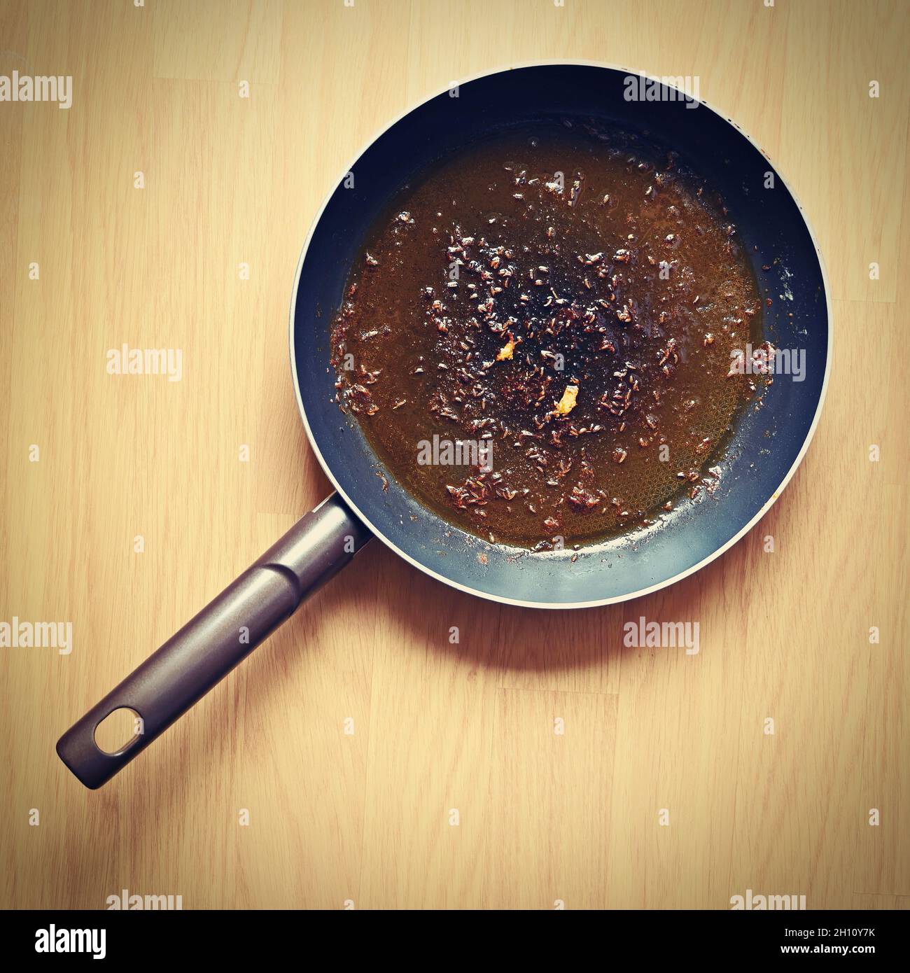Dirty pan spoon in kitchen hi-res stock photography and images - Alamy