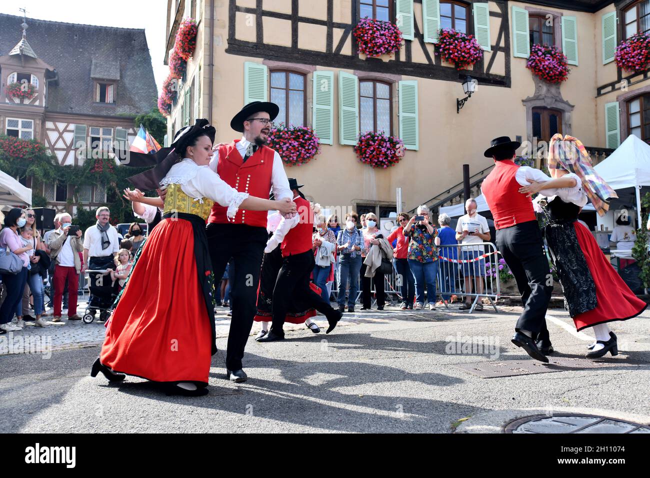 Traditional Alsace folk dancing in the village of Turkheim during the ...