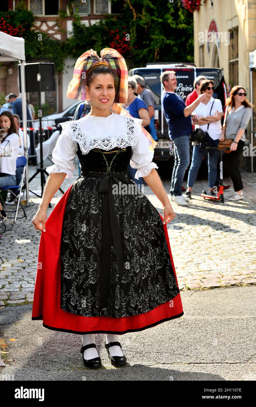 Traditional Alsace folk dancer wearing Alsation costume in the village ...
