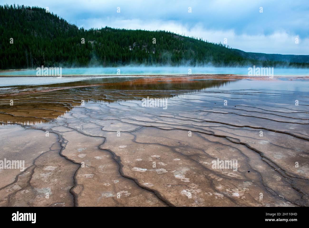 Grand Prismatic Spring, Midway Geyser Basin, with steam and reflections ...