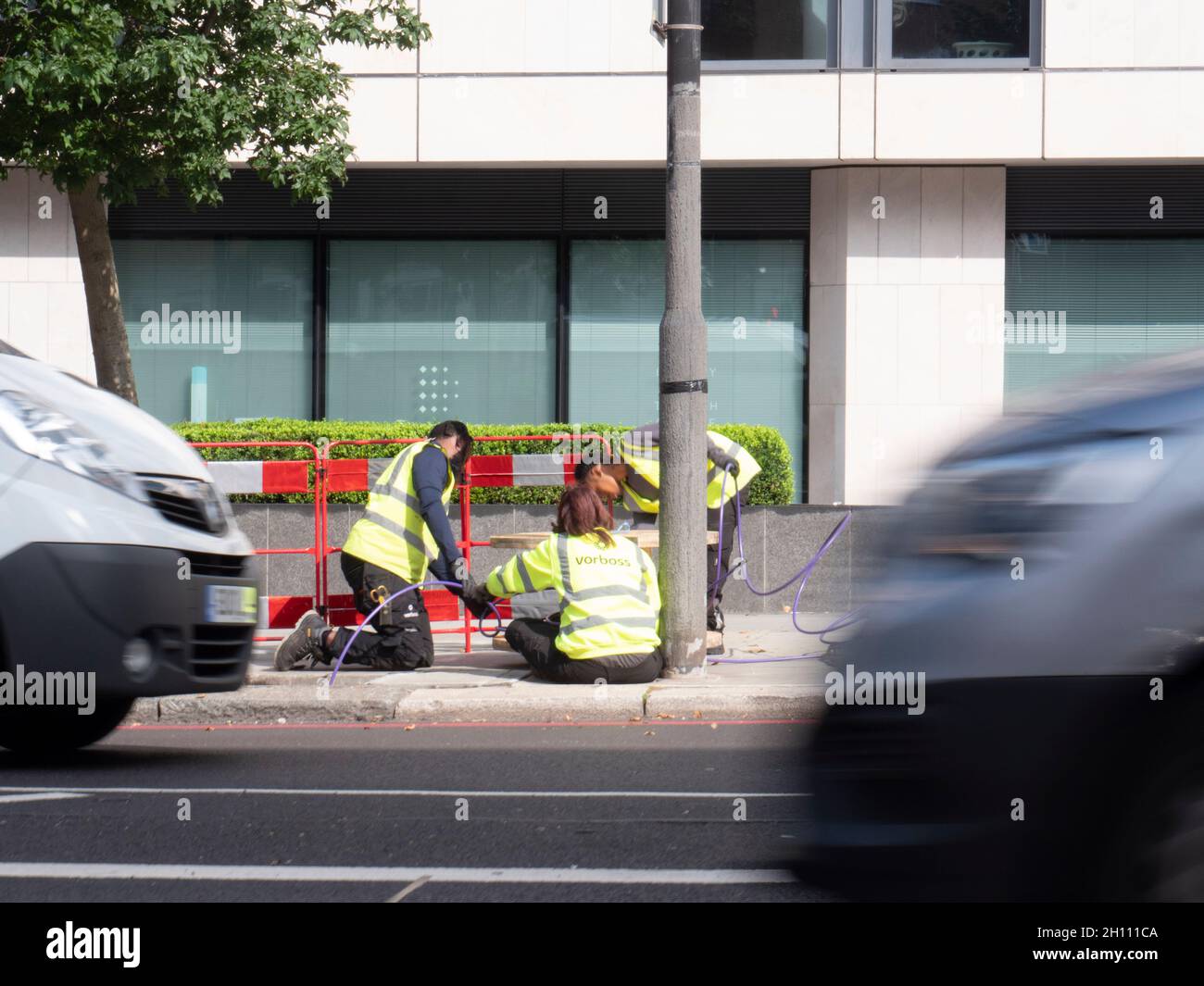 Installers fitting cabling for Vorboss fibre networks in Central London ...
