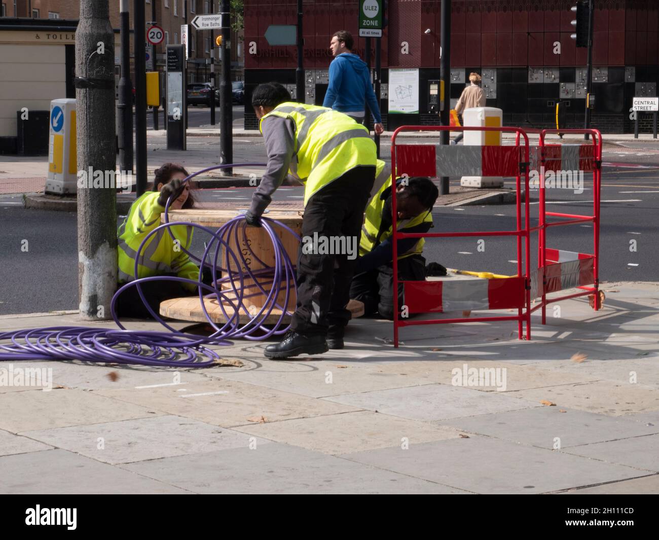 Installers fitting cabling for Vorboss fibre networks in Central London ...