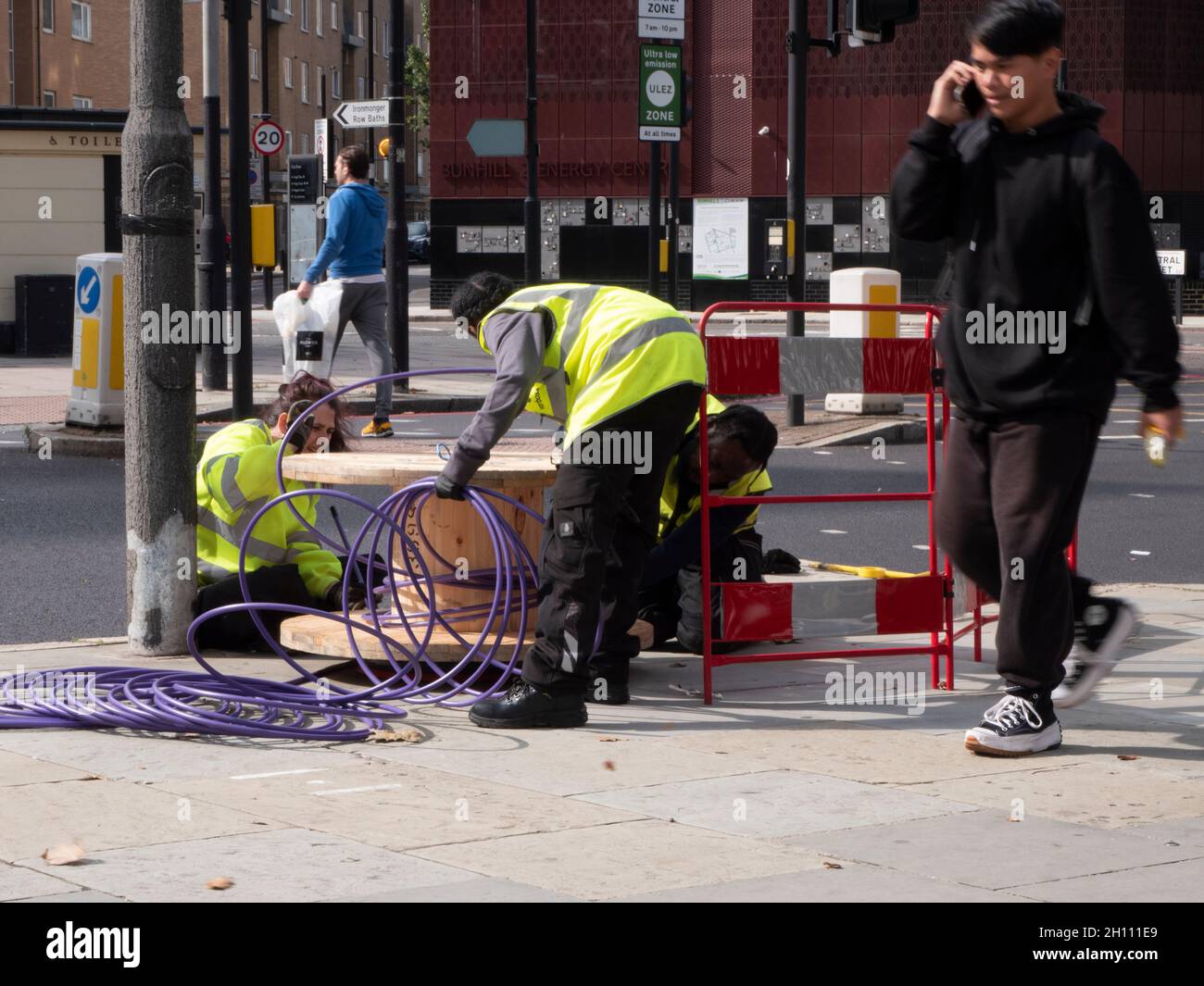 Installers fitting cabling for Vorboss fibre networks in Central London ...