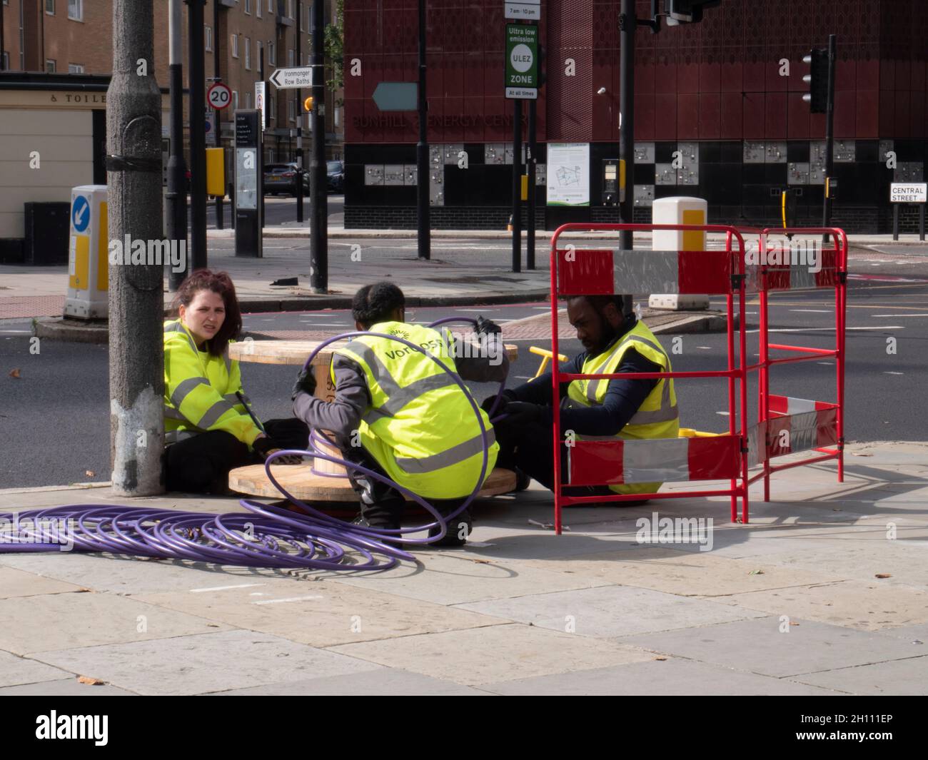 Installers fitting cabling for Vorboss fibre networks in Central London ...