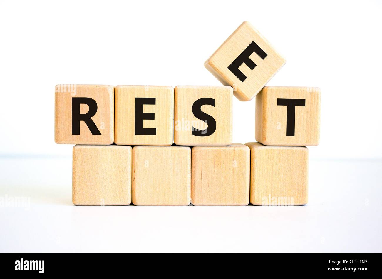 Reset symbol. The concept word 'reset' on wooden cubes. Beautiful white ...