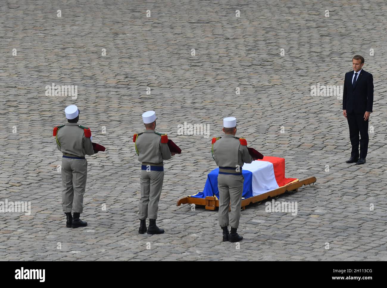 French President Emmanuel Macron in front of Hubert Germain's coffin at ...
