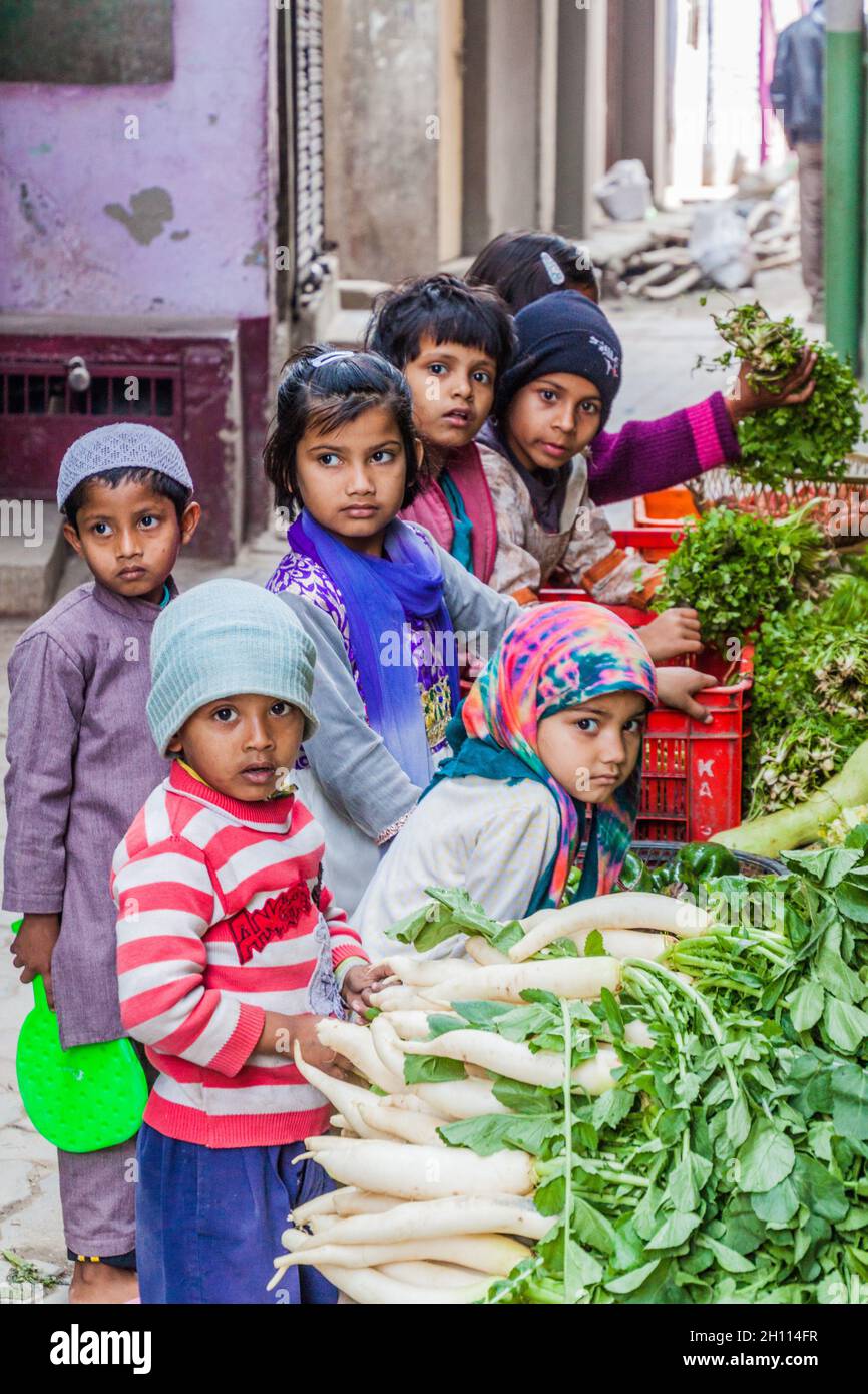 LUCKNOW, INDIA - FEBRUARY 3, 2017: Children at a vegetable stall in ... LUCKNOW, INDIA - FEBRUARY 3, 2017: Children at a vegetable stall in ...