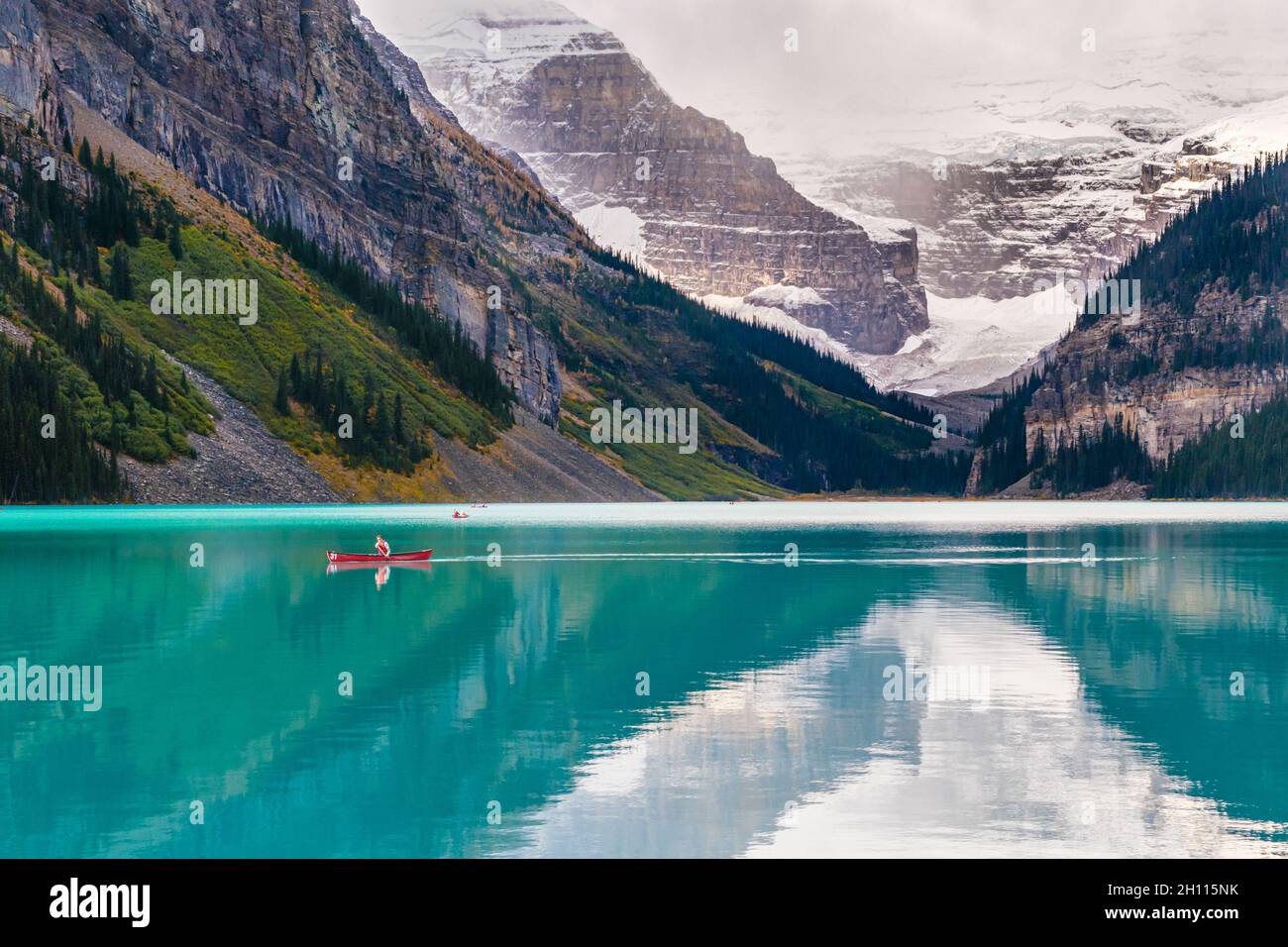 Lake Louise, Alberta, Canada - 29 September 2021: Man riding a Canoe on ...