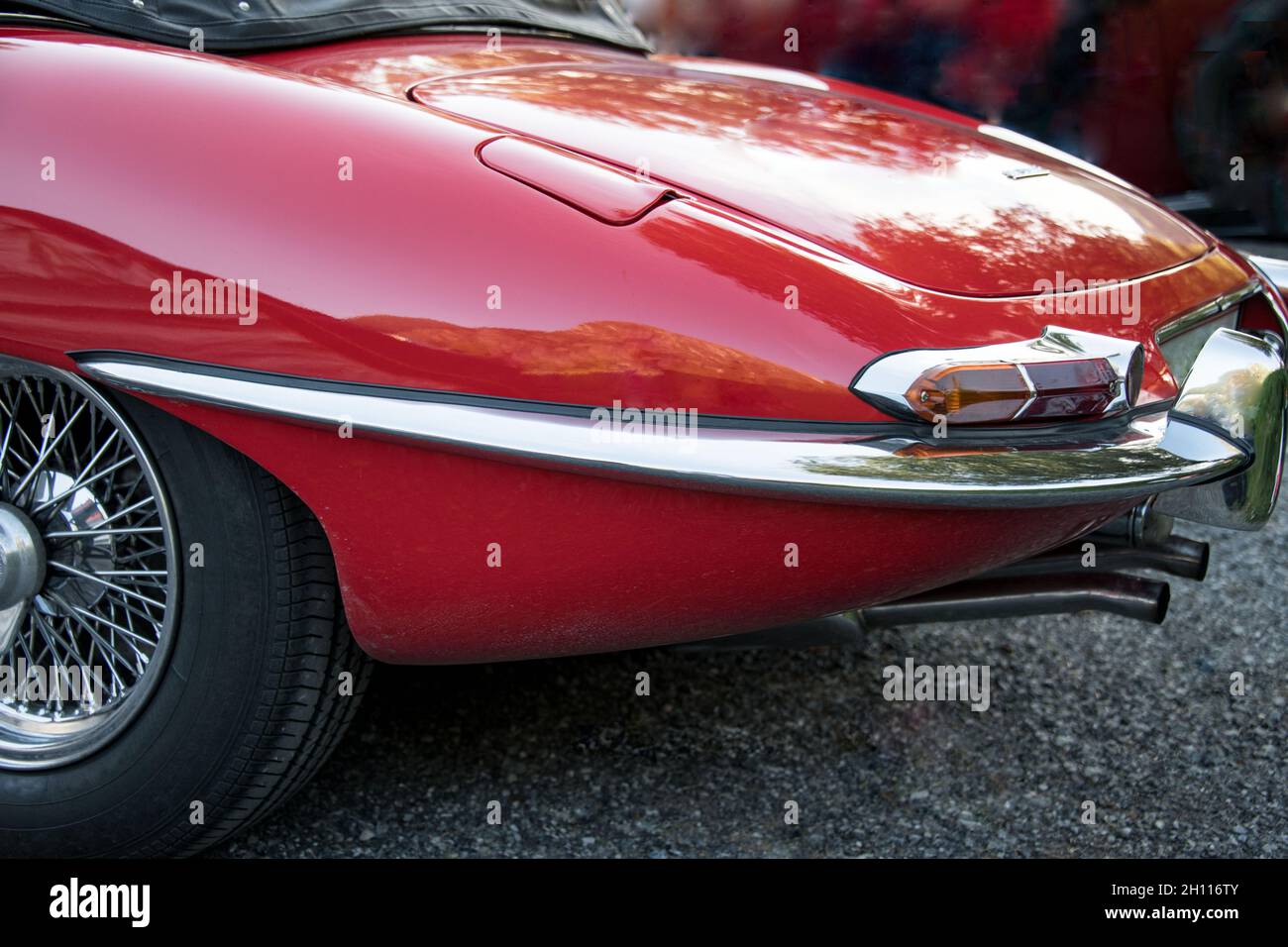 Partial view of the rear of a classic red sports car with taillights ...