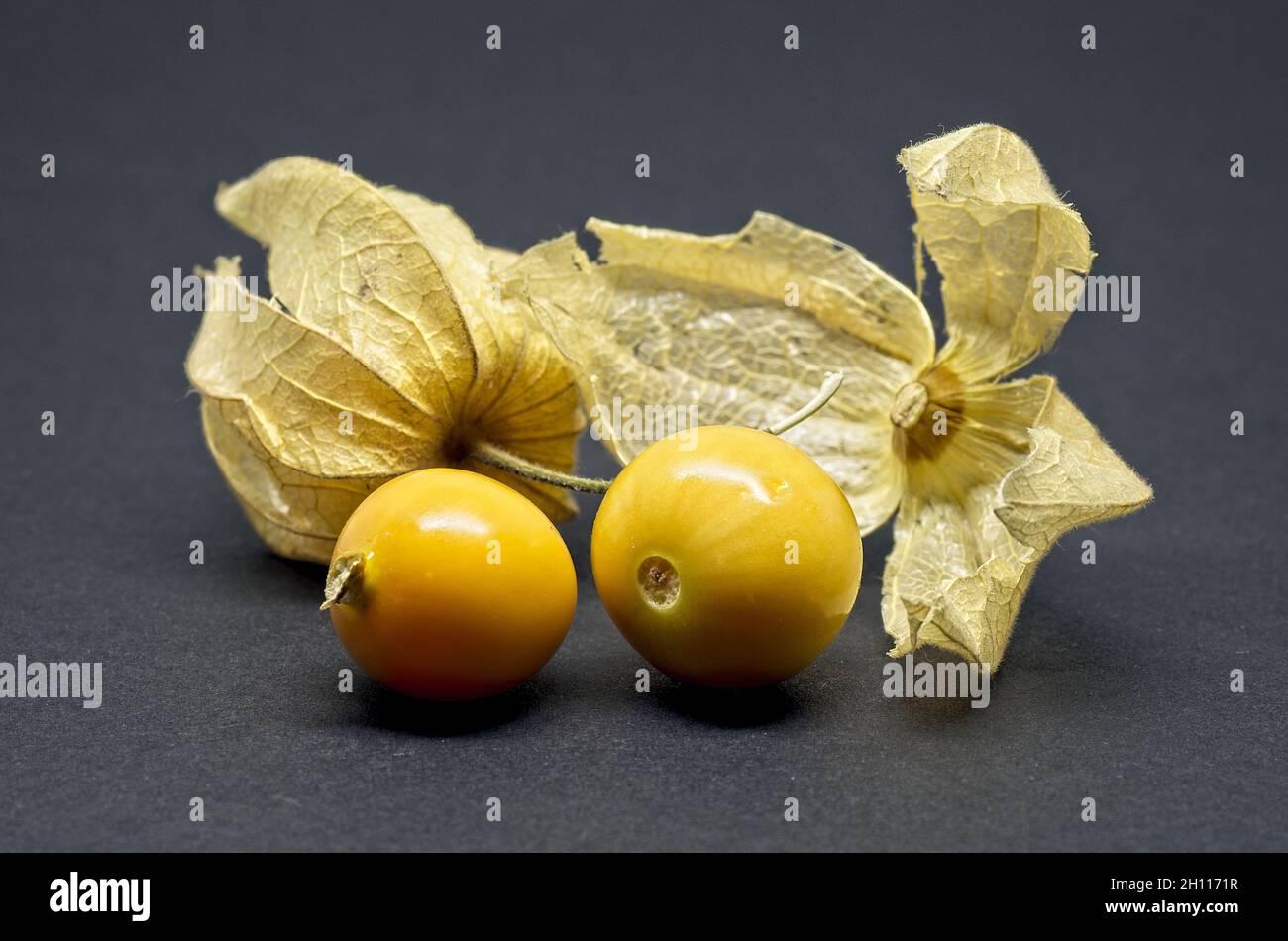 Fresh physalis fruit on black background. Healthy eating Stock Photo ...