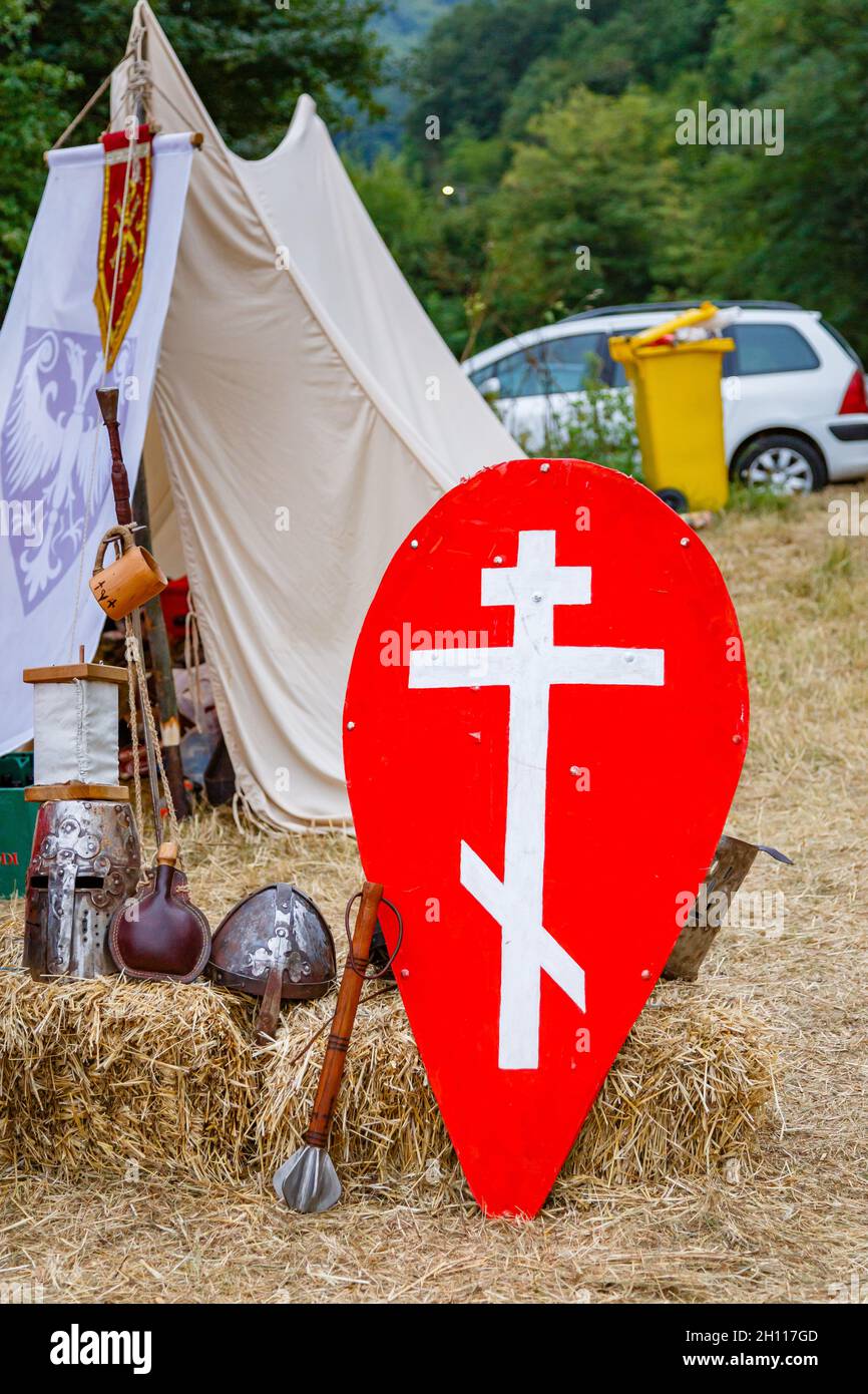 Vibrant red templar shield in a camp Stock Photo - Alamy