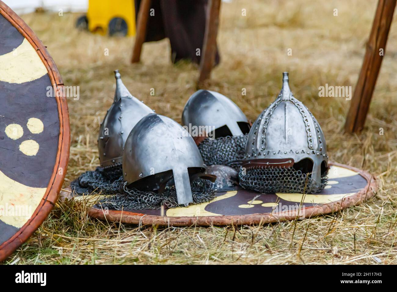 Medieval armor helmets on a shield in the camp Stock Photo - Alamy