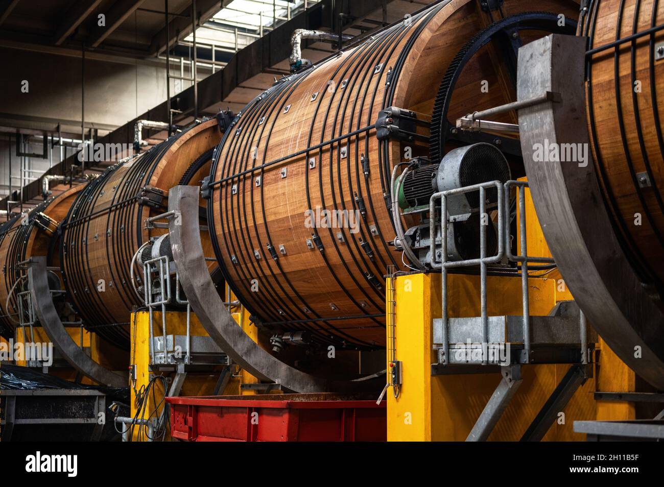 Large wooden barrels for the tanning of cattle leather Stock Photo - Alamy