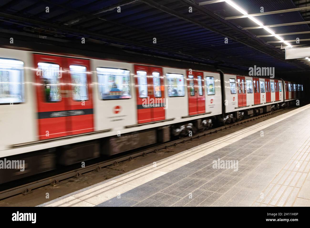Train in movement arriving at the station Stock Photo - Alamy
