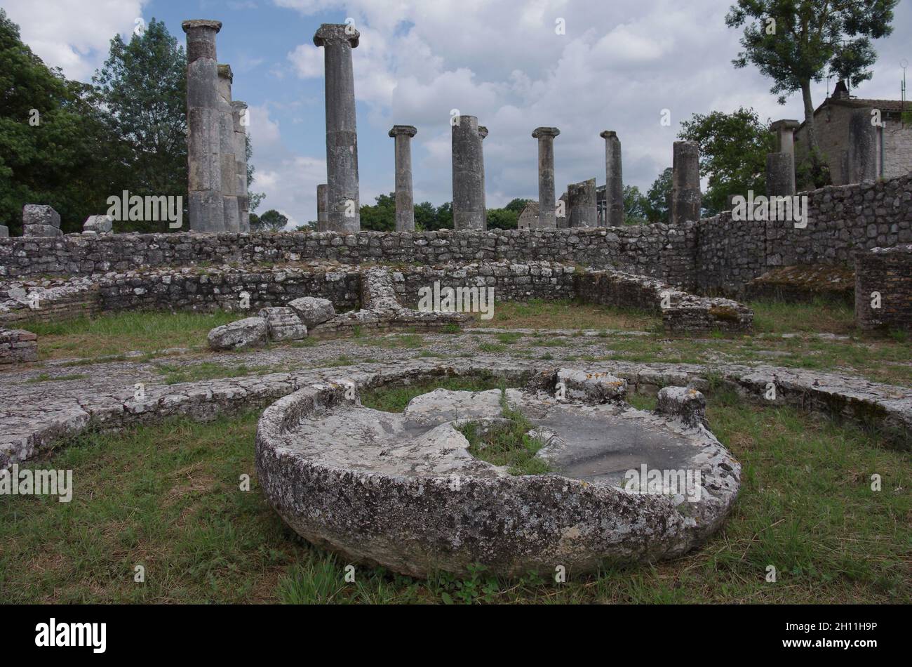 The Macellum or market: in the foreground an ancient millstone of a ...