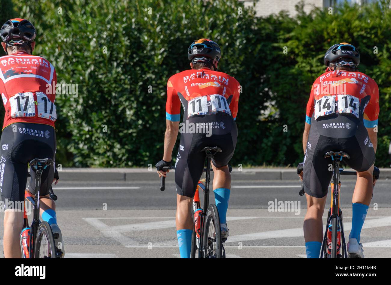 ZAGREB, CROATIA - Oct 03, 2021: Professional bike riders wearing red jerseys of team bahrain ...