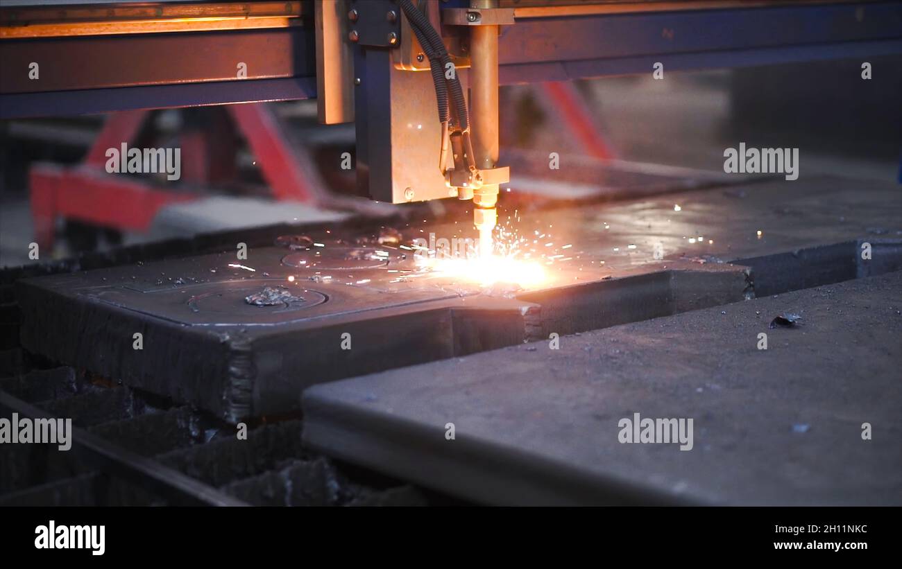 Welding patterns on metal in factory. Clip. Automated machine for ...