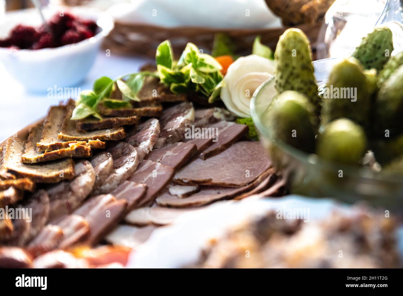 Meats on the table, lard and pickled cucumbers. Polish food, cold ...