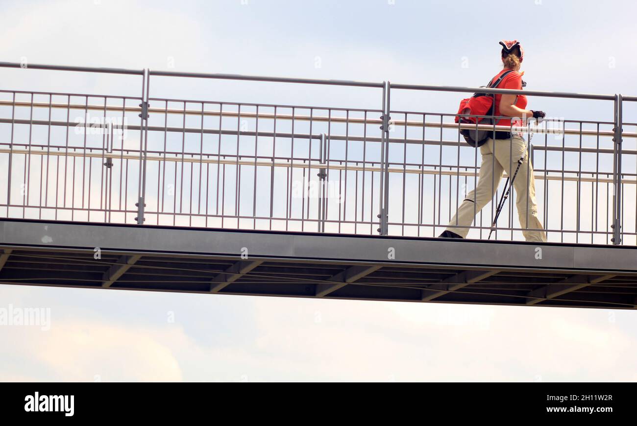 Man woman crossing bridge hi-res stock photography and images - Alamy