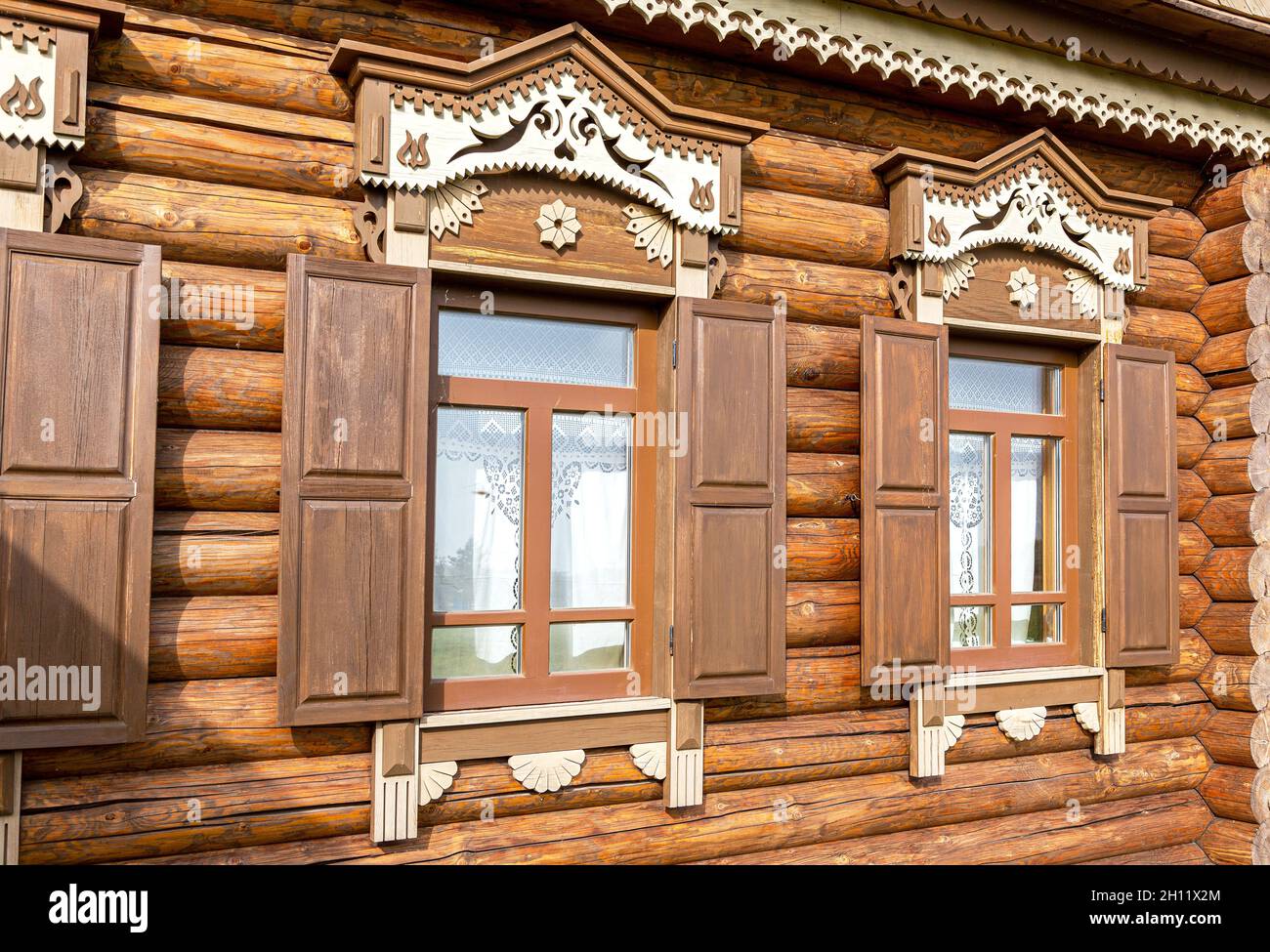 Russian traditional wooden architecture. Windows of wooden house ...
