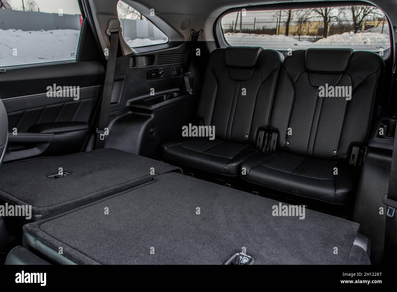 Folding seats and a cargo space inside suv car. Modern car interior ...