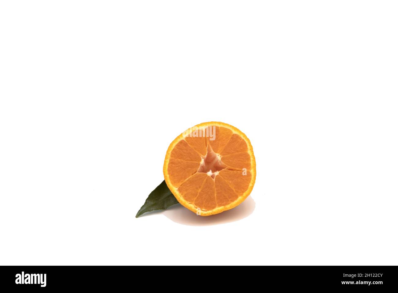 Closeup of a fresh ripe orange cut in half isolated on a white ...