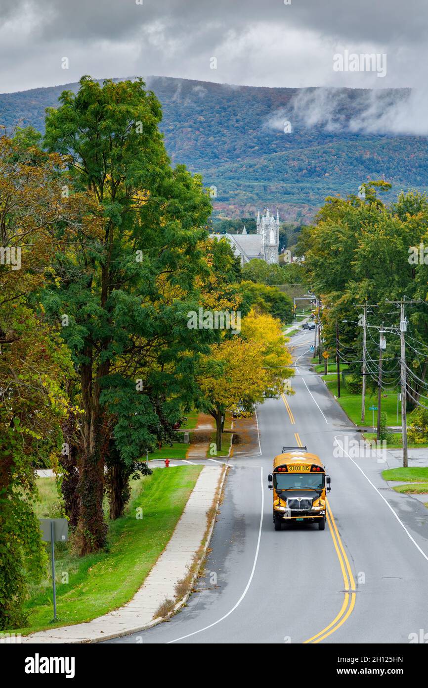Yellow school bus traveling on Main Street in Bennington, Vermont Stock ...