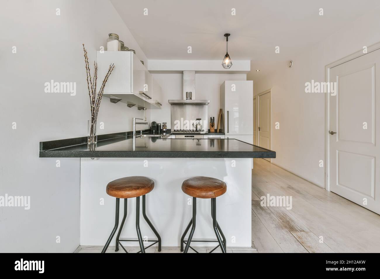 Modern kitchen combined with a hallway Stock Photo - Alamy
