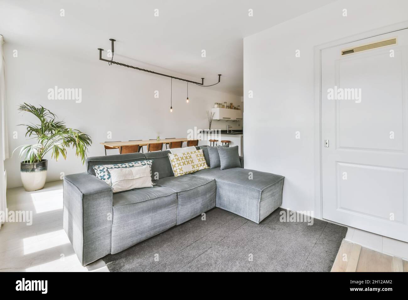 Furnished rest zone in a modern minimalist style apartment Stock Photo ...