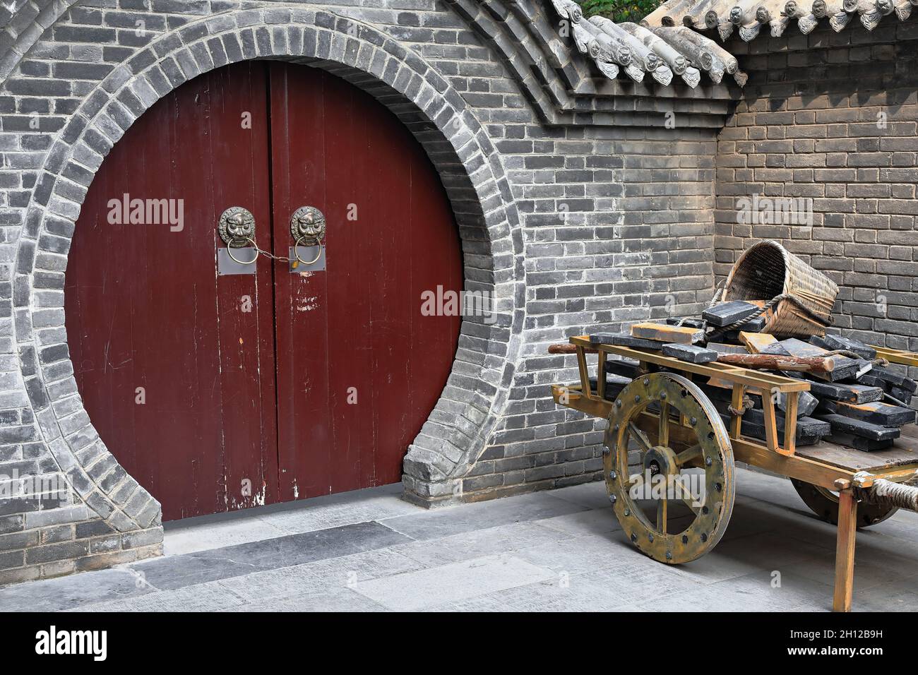 Maroon painted-round door-wooden cart-building materials. City Wall's ...