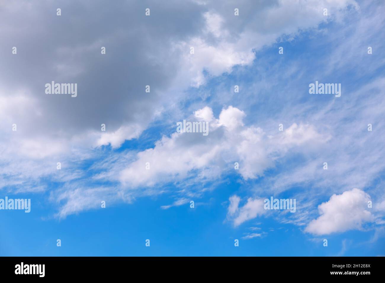 Midday blue sky with gray and white clouds Stock Photo - Alamy