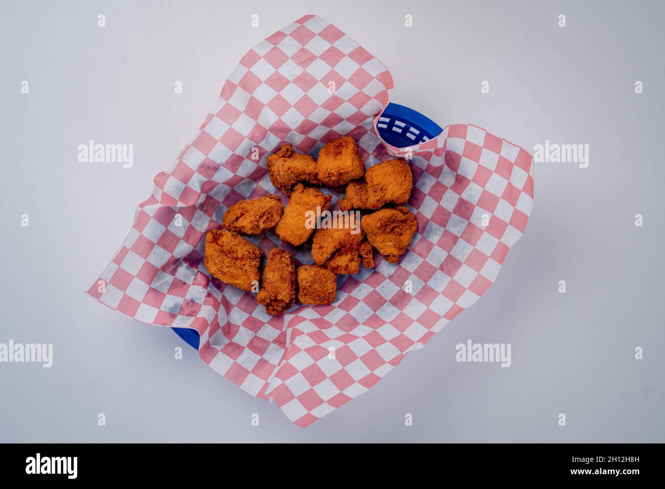 Closeup top view of a fried chicken bites isolated on a white ...