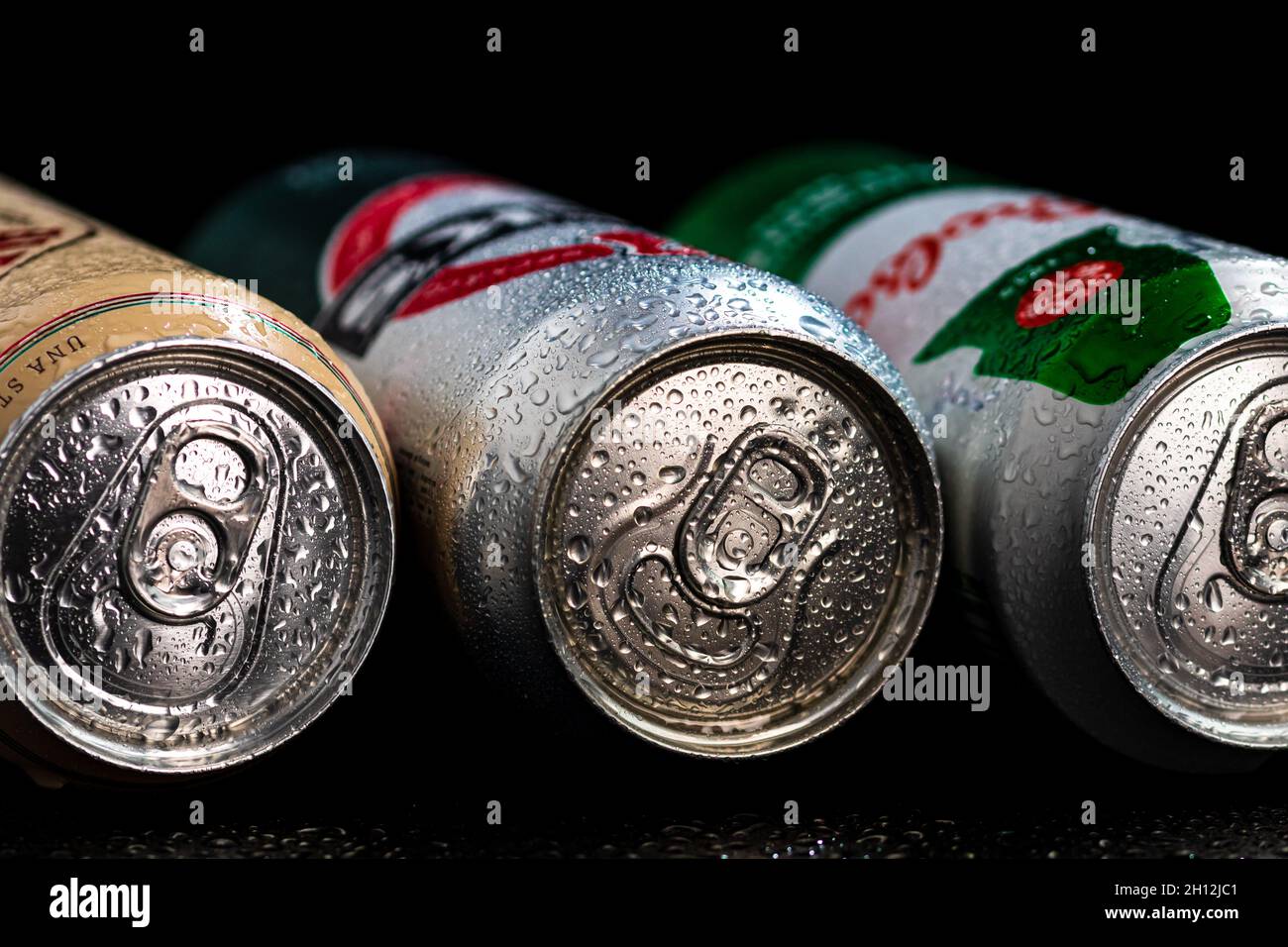 Condensation water droplets on beer cans isolated on black. Bucharest ...