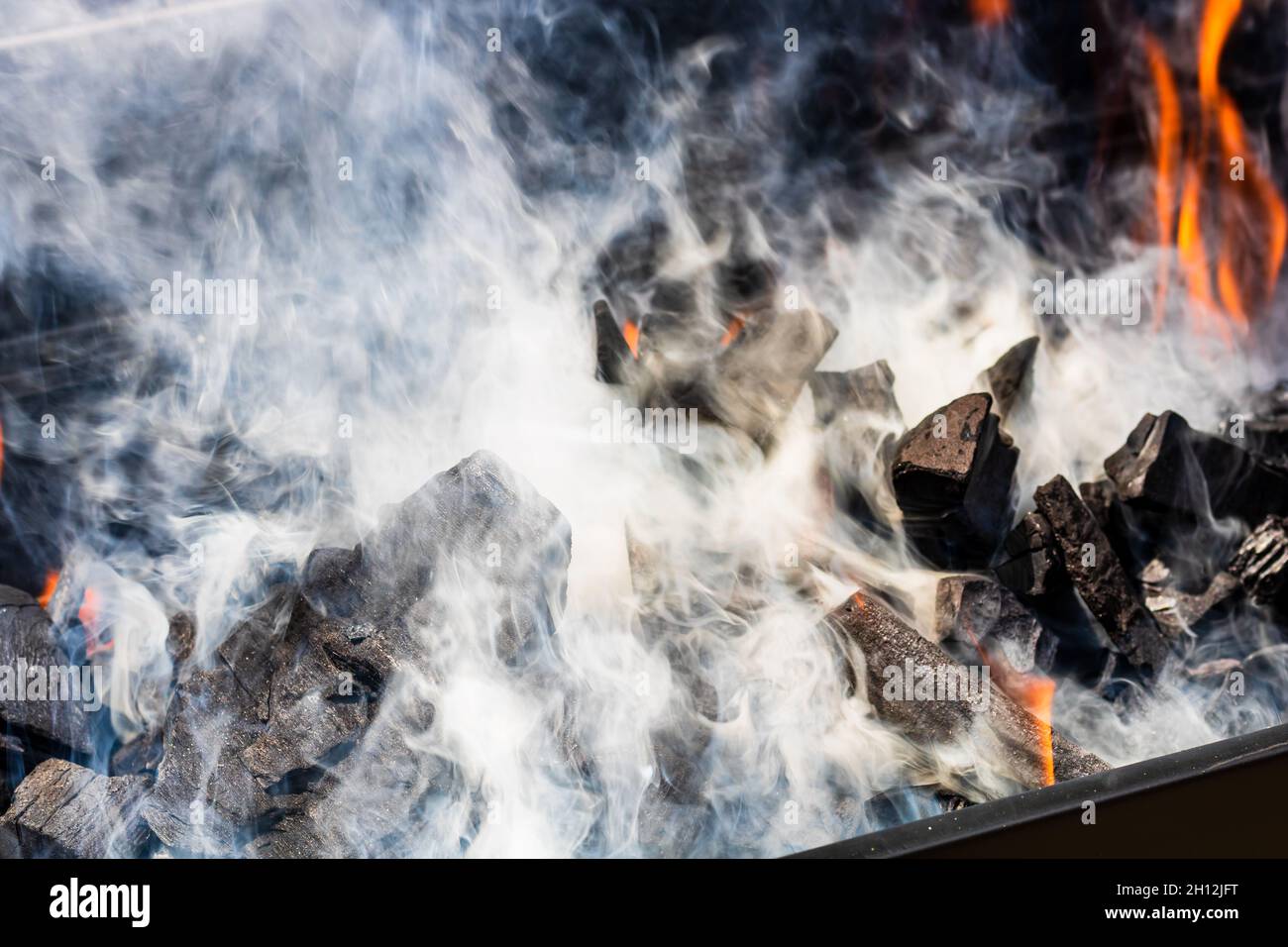 Barbecue grill pit with glowing and flaming hot open fire with red ...