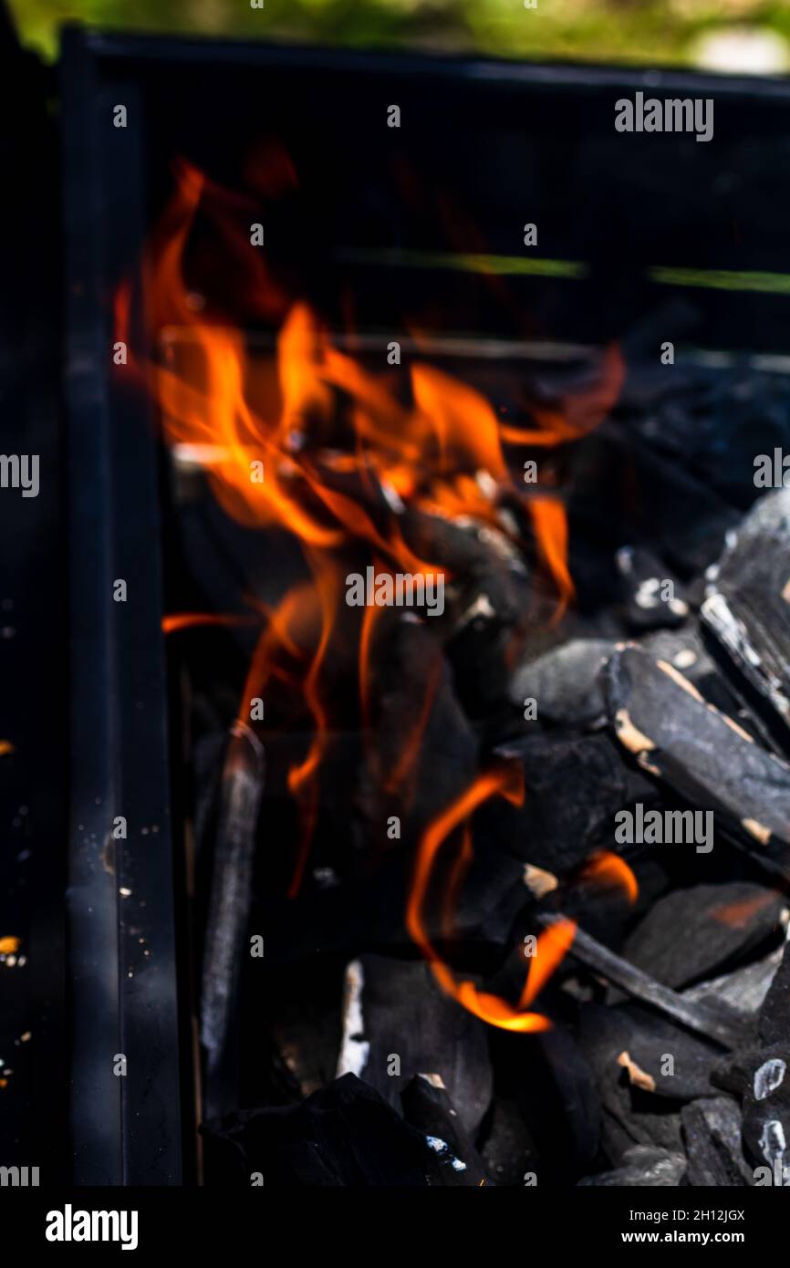 Barbecue grill pit with glowing and flaming hot open fire with red ...