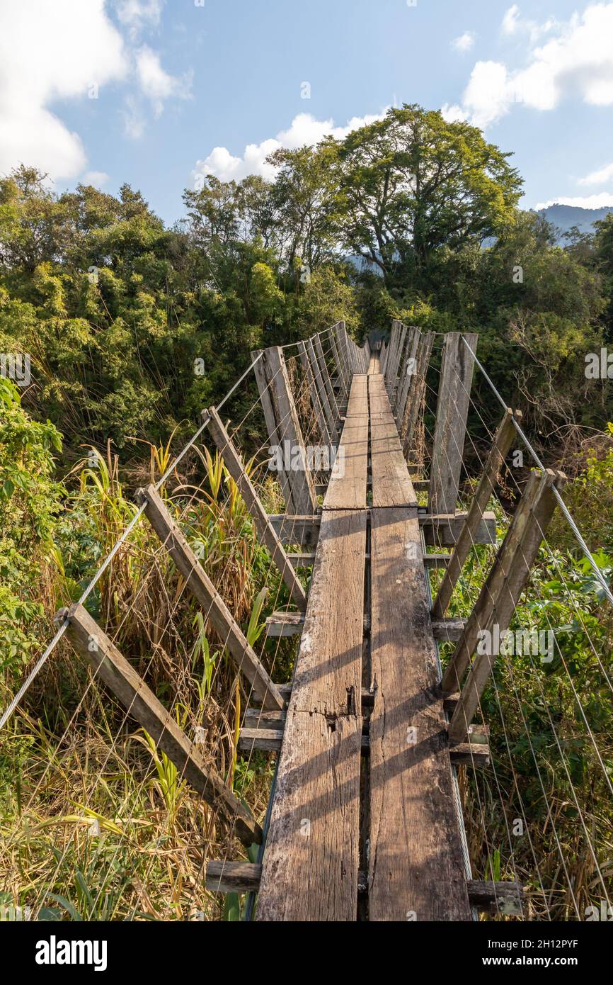 Wood and iron bridge over Cadeia river with forest around in Sao Jose ...