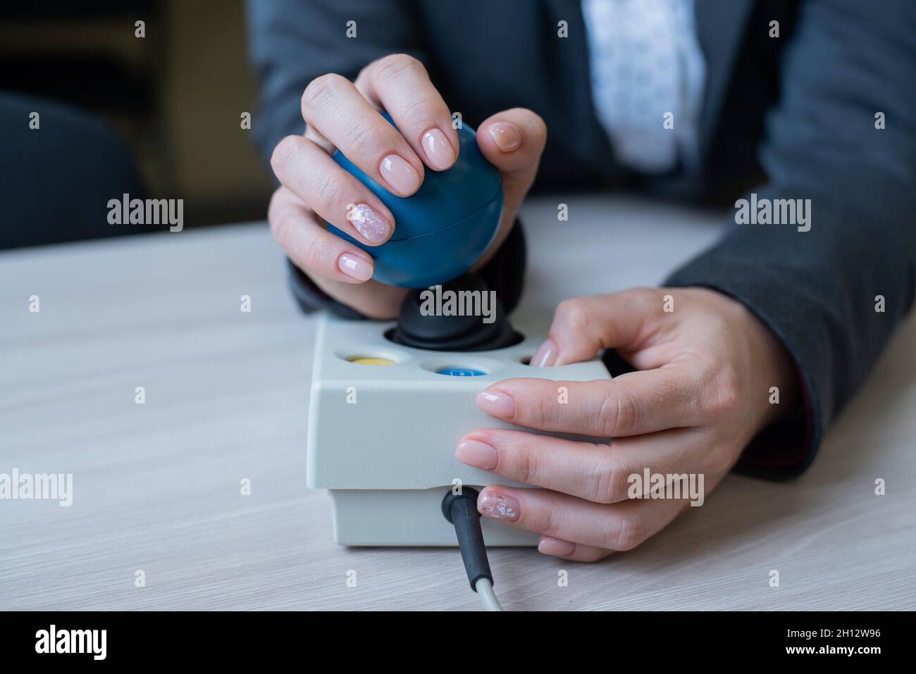 Woman with cerebral palsy works on a specialized computer mouse Stock ...