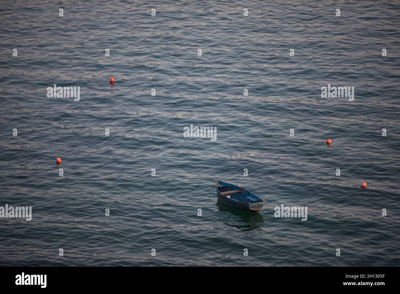 High angle image of a empty wooden boat floating on water Stock Photo ...
