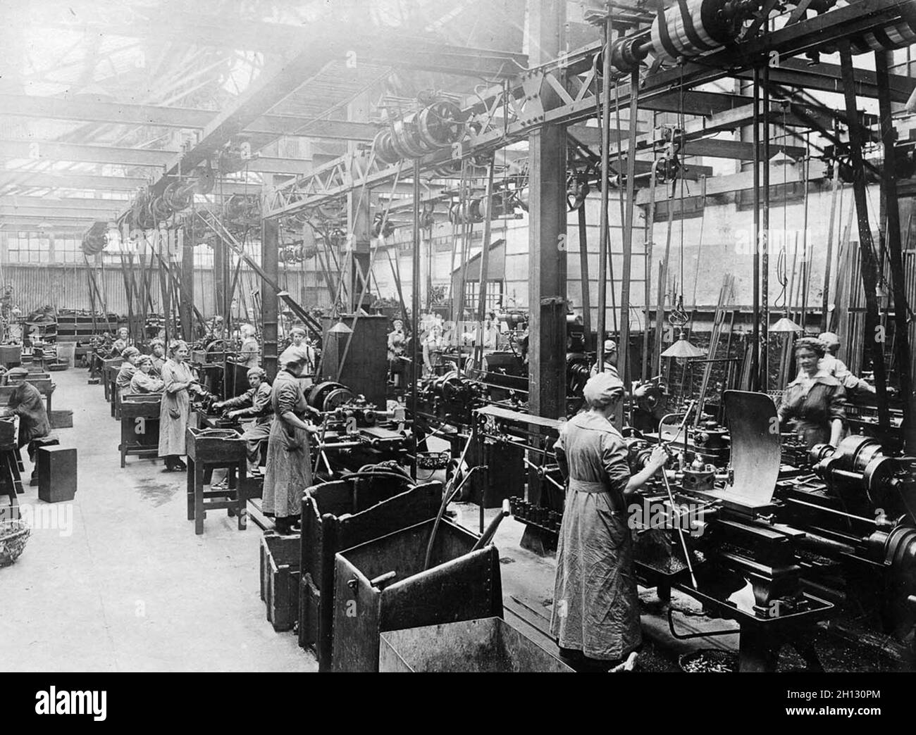 Workers build parts for boilers and condensers in a factory during WW1 ...