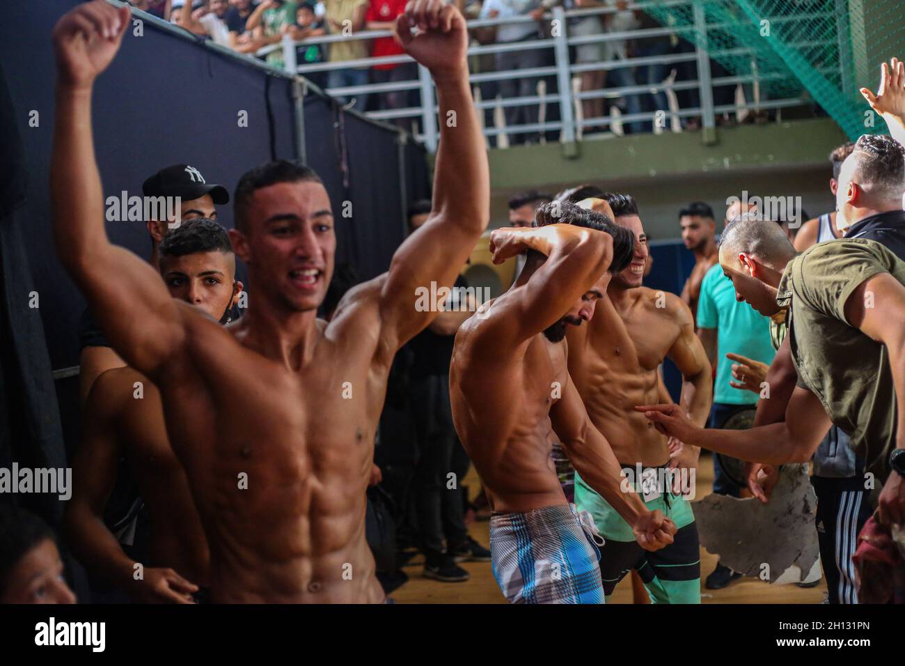 Gaza, Palestine. 15th Oct, 2021. Athletes display their body muscles ...