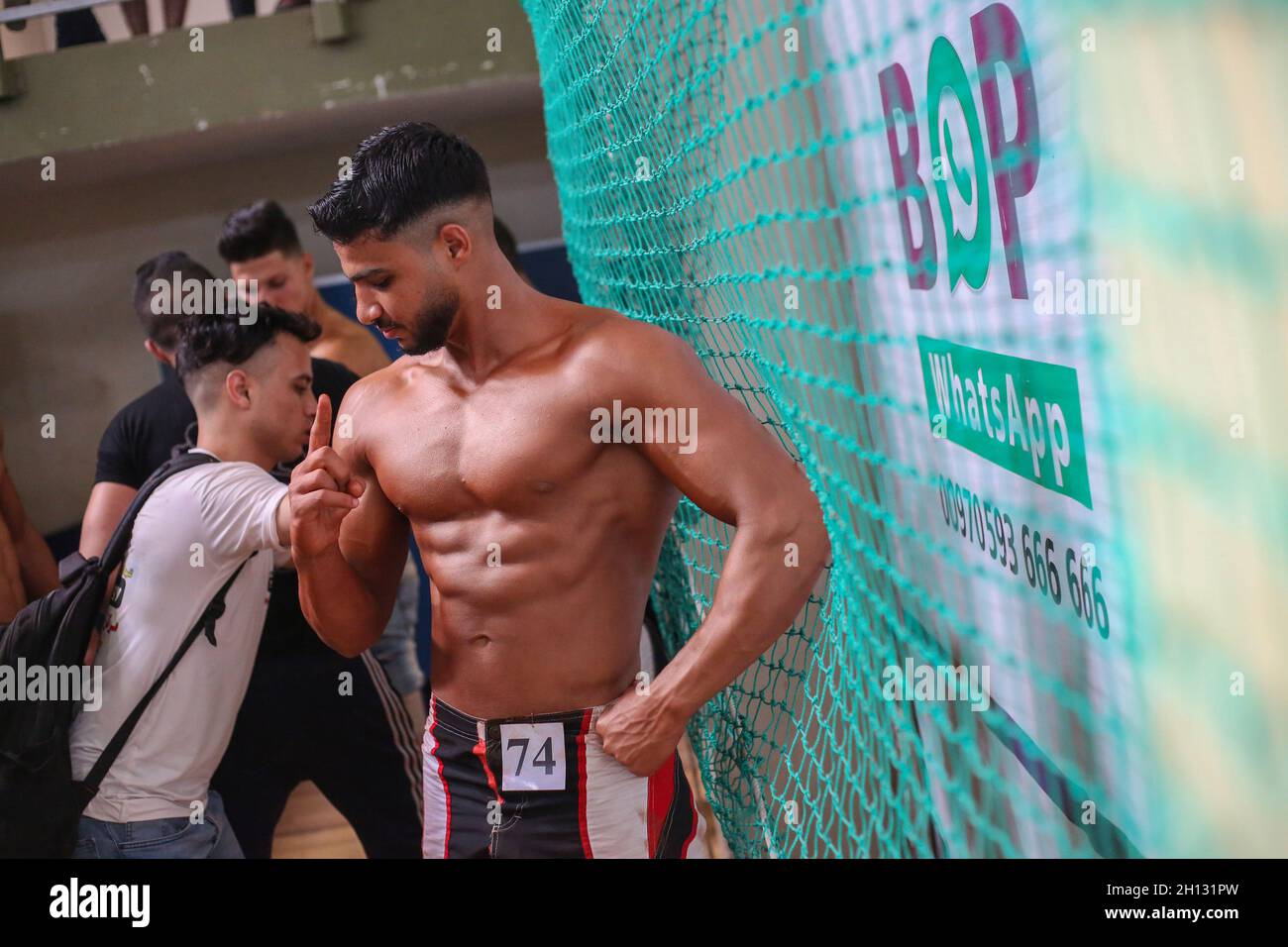 Gaza, Palestine. 15th Oct, 2021. An athlete displays his body muscles ...