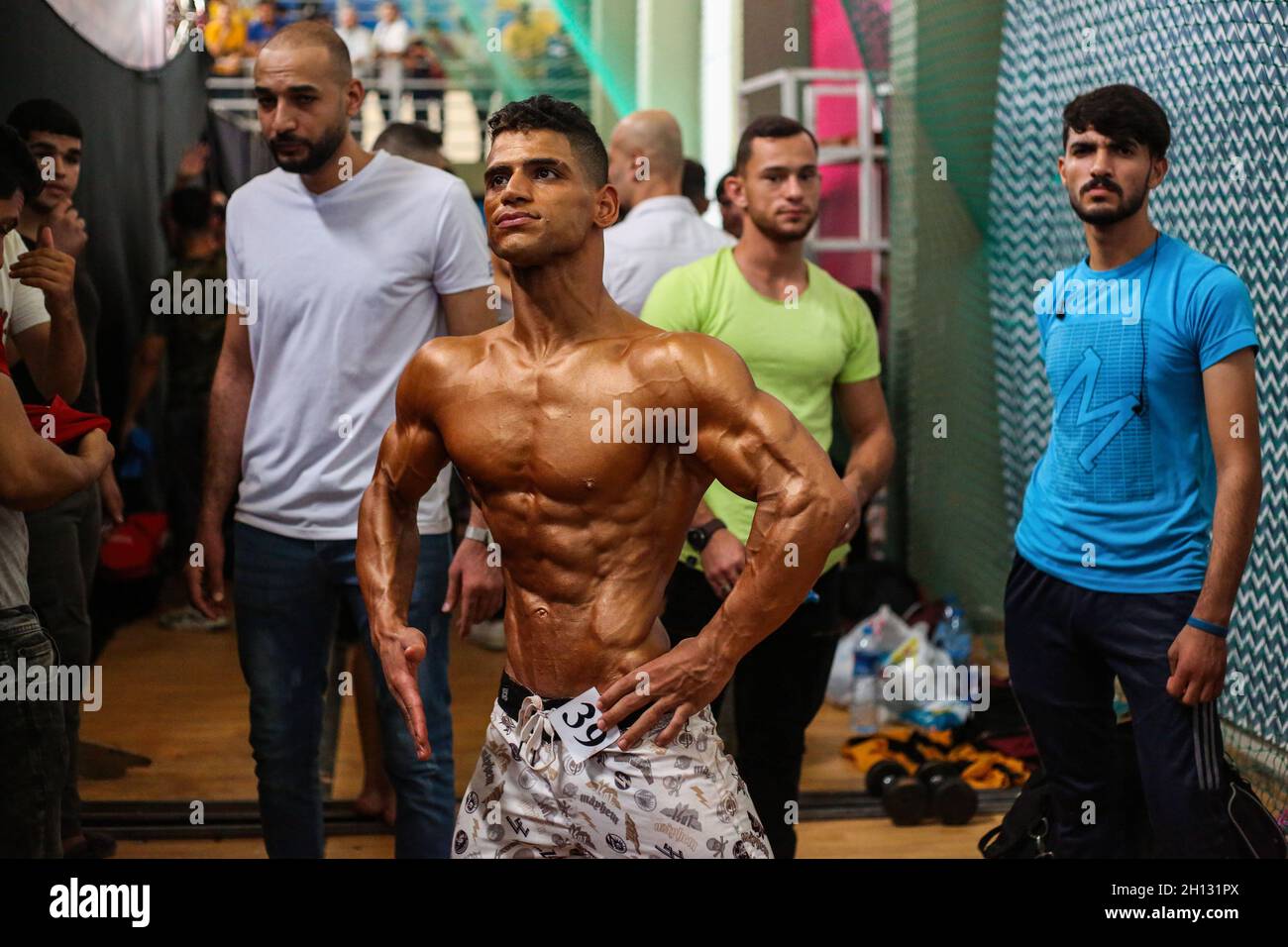 Gaza, Palestine. 15th Oct, 2021. An athlete displays his body muscles ...