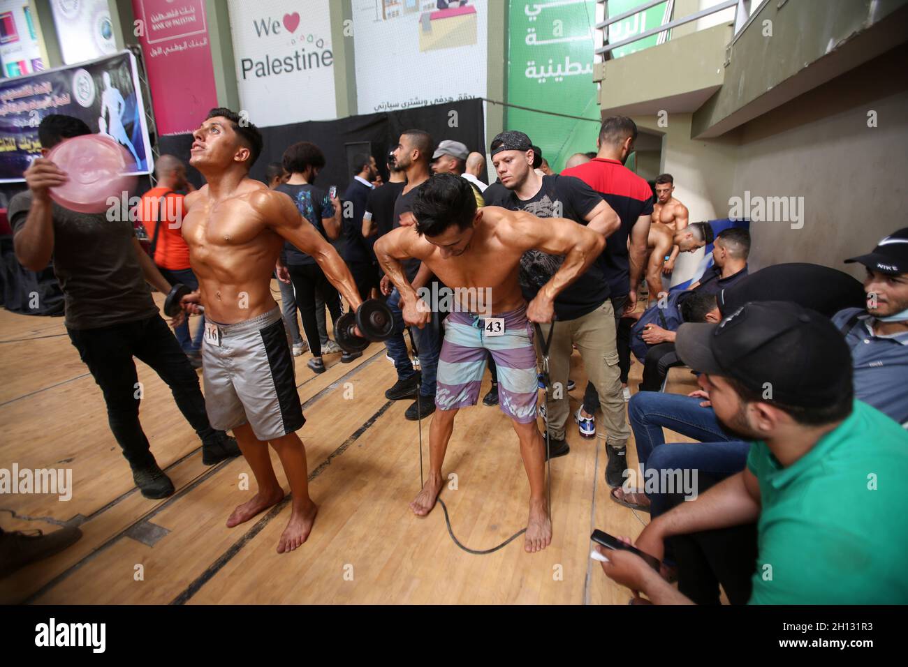 Gaza, Palestine. 15th Oct, 2021. Athletes display their body muscles ...
