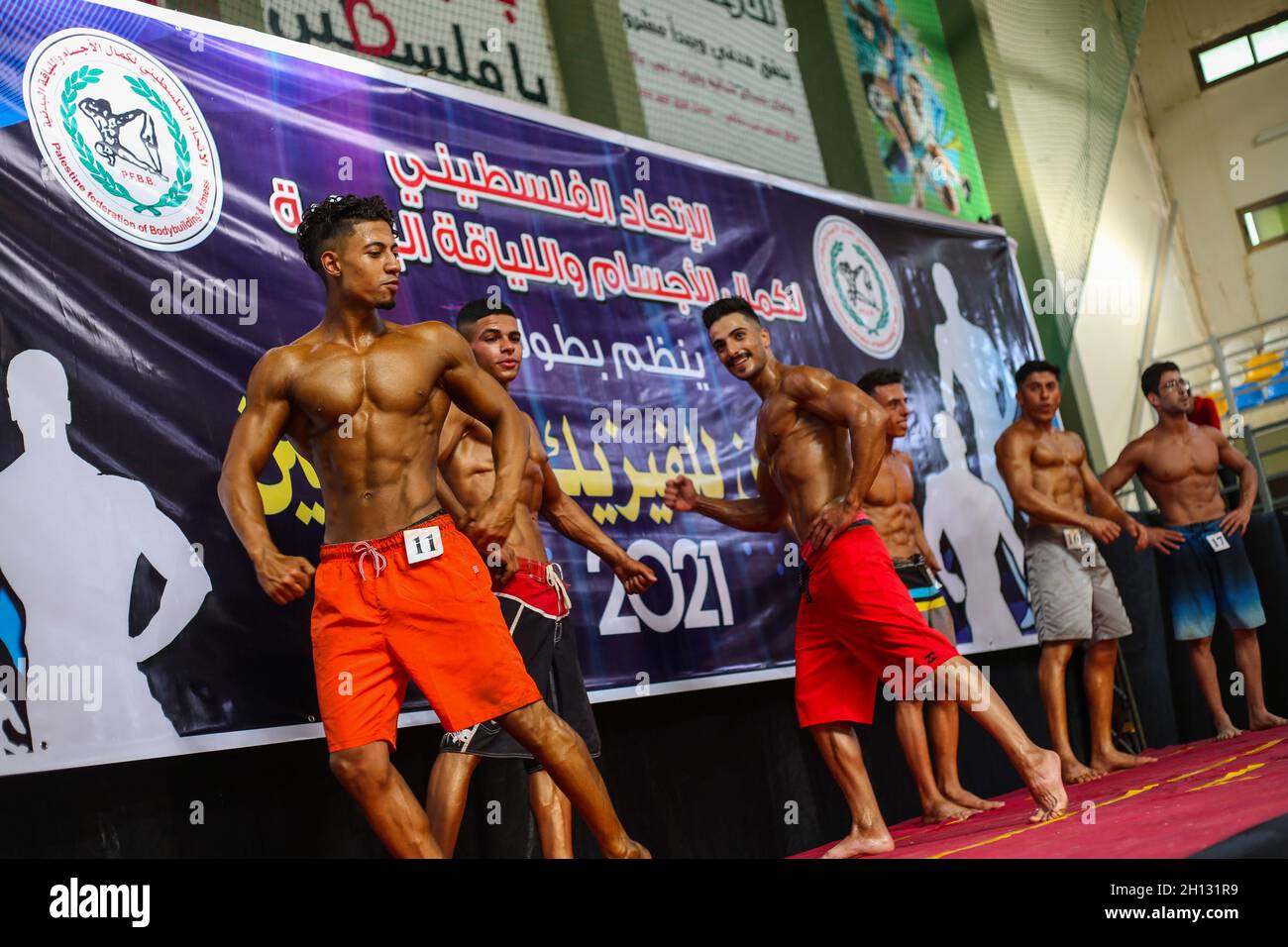 Gaza, Palestine. 15th Oct, 2021. Athletes display their body muscles ...