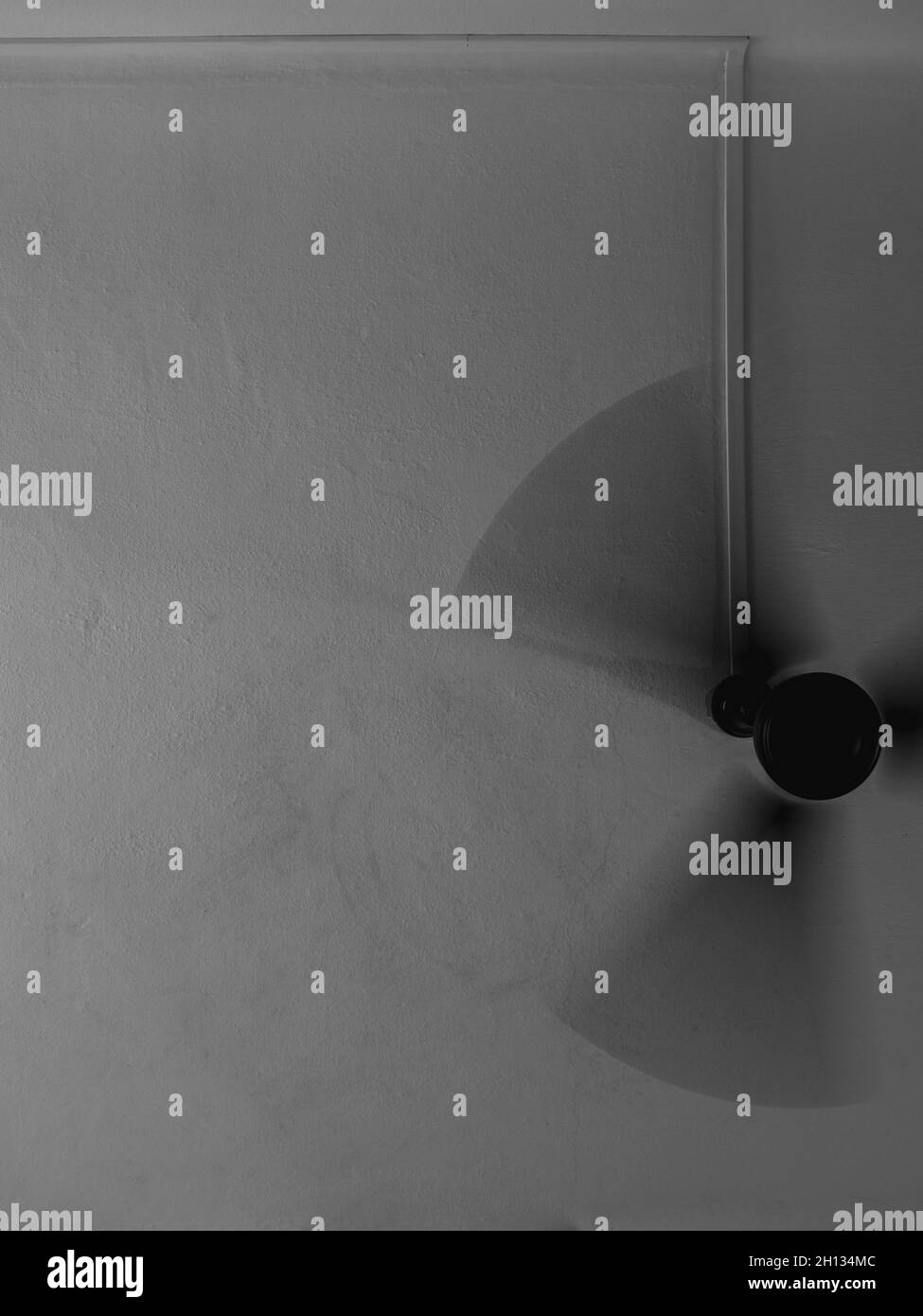 Black Spinning ceiling fan against white background Stock Photo - Alamy