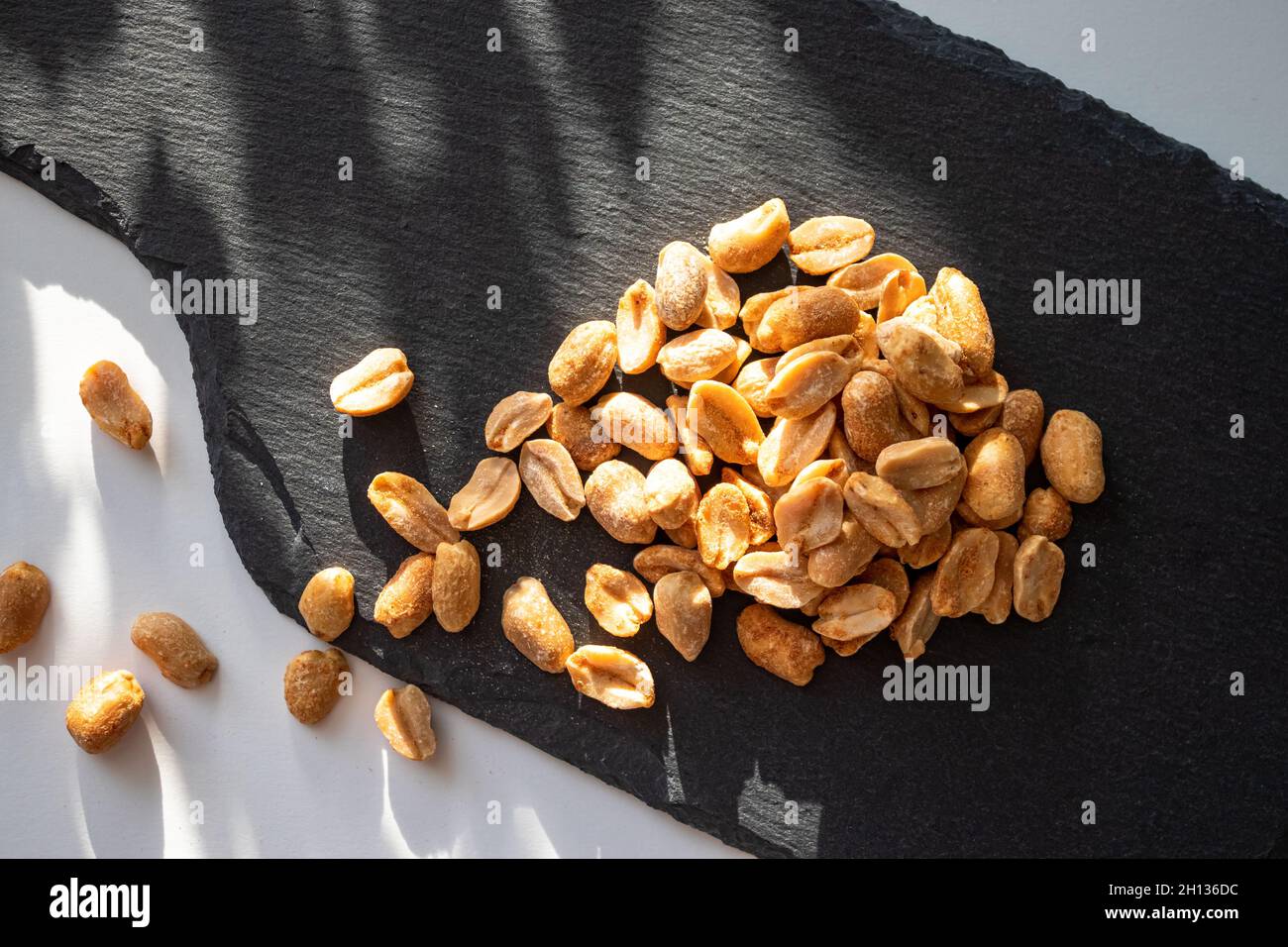 Chili lemon peanuts on stone cutting board Stock Photo - Alamy